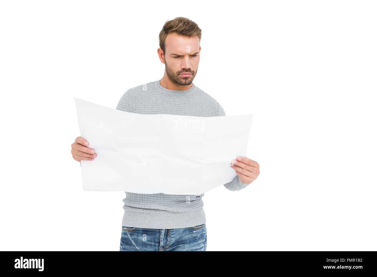 Young man looking at map Stock Photo - Alamy