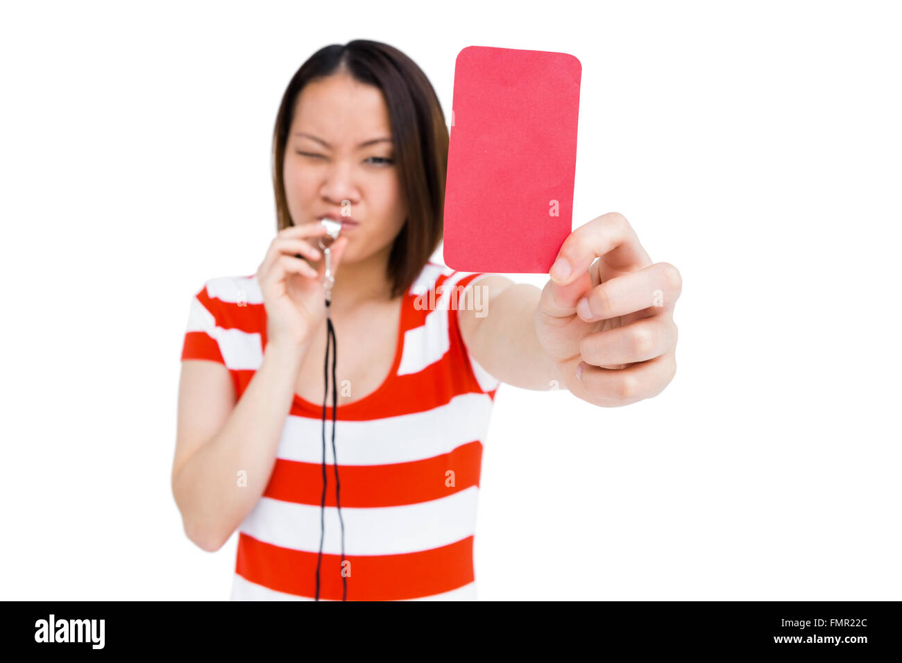 Young woman whistling and showing red card Stock Photo - Alamy