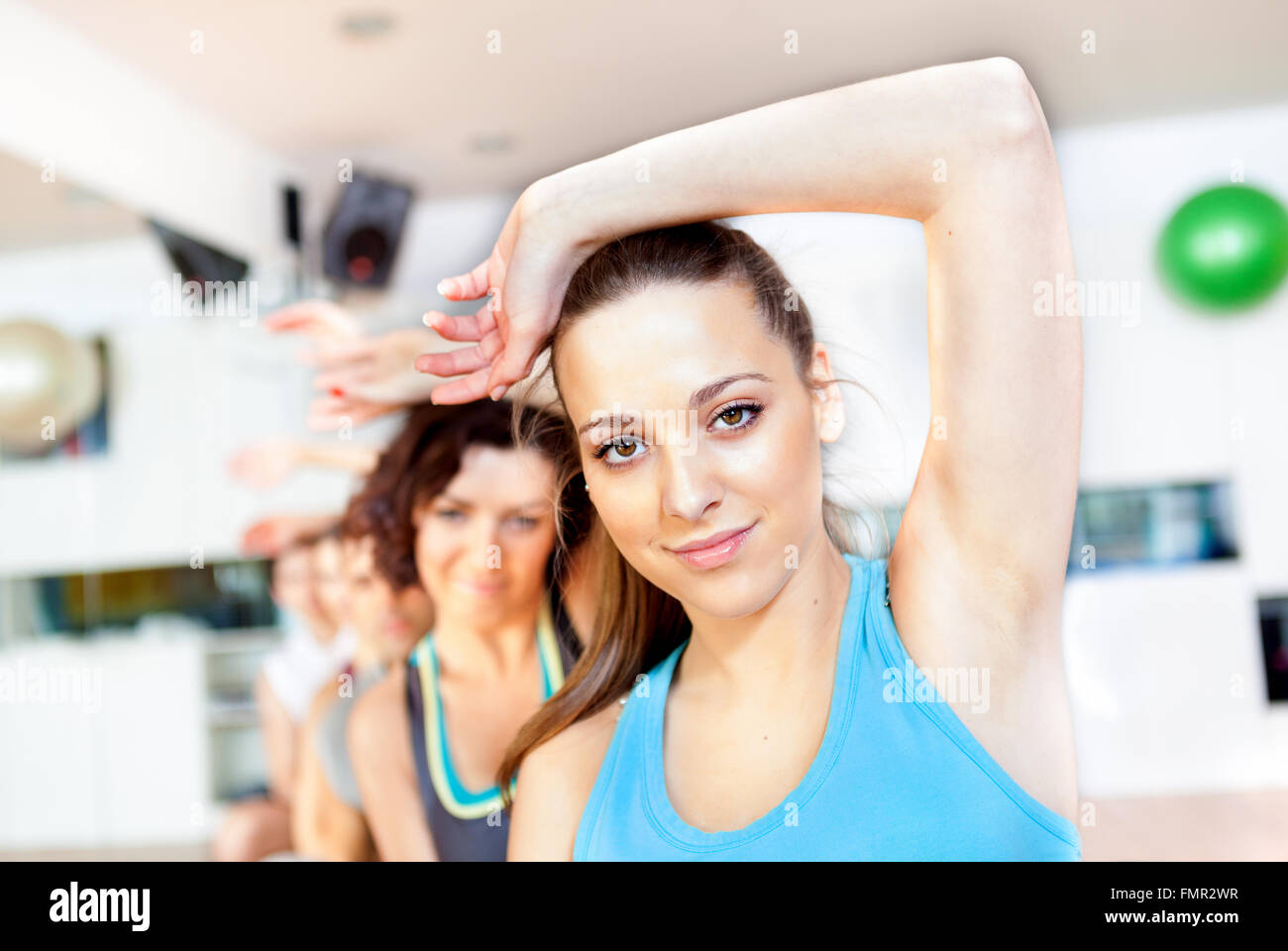 Group of people stretching at the gym Stock Photo - Alamy