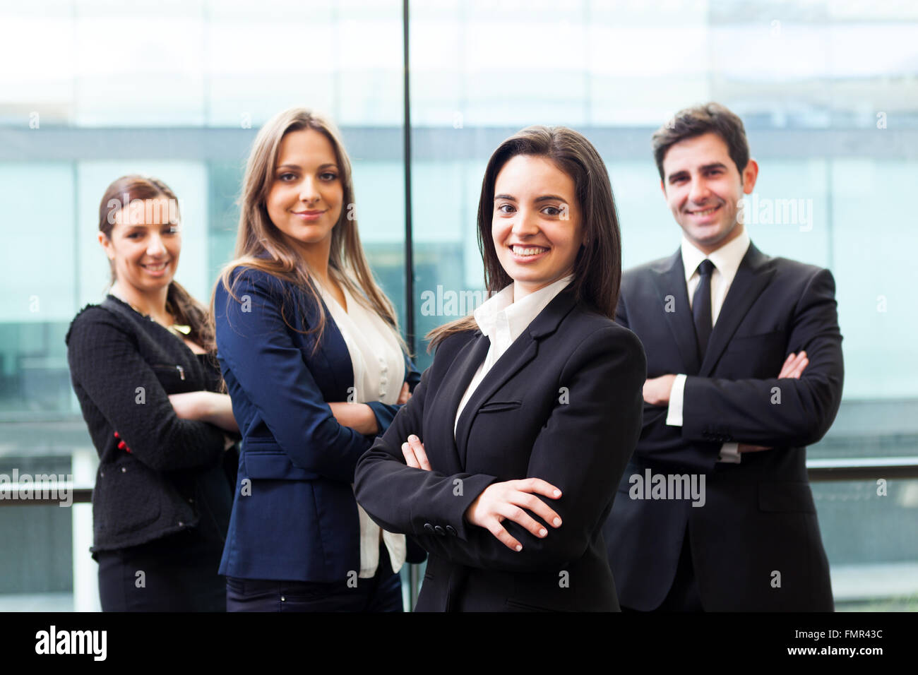 Group of business people smiling at the office Stock Photo - Alamy