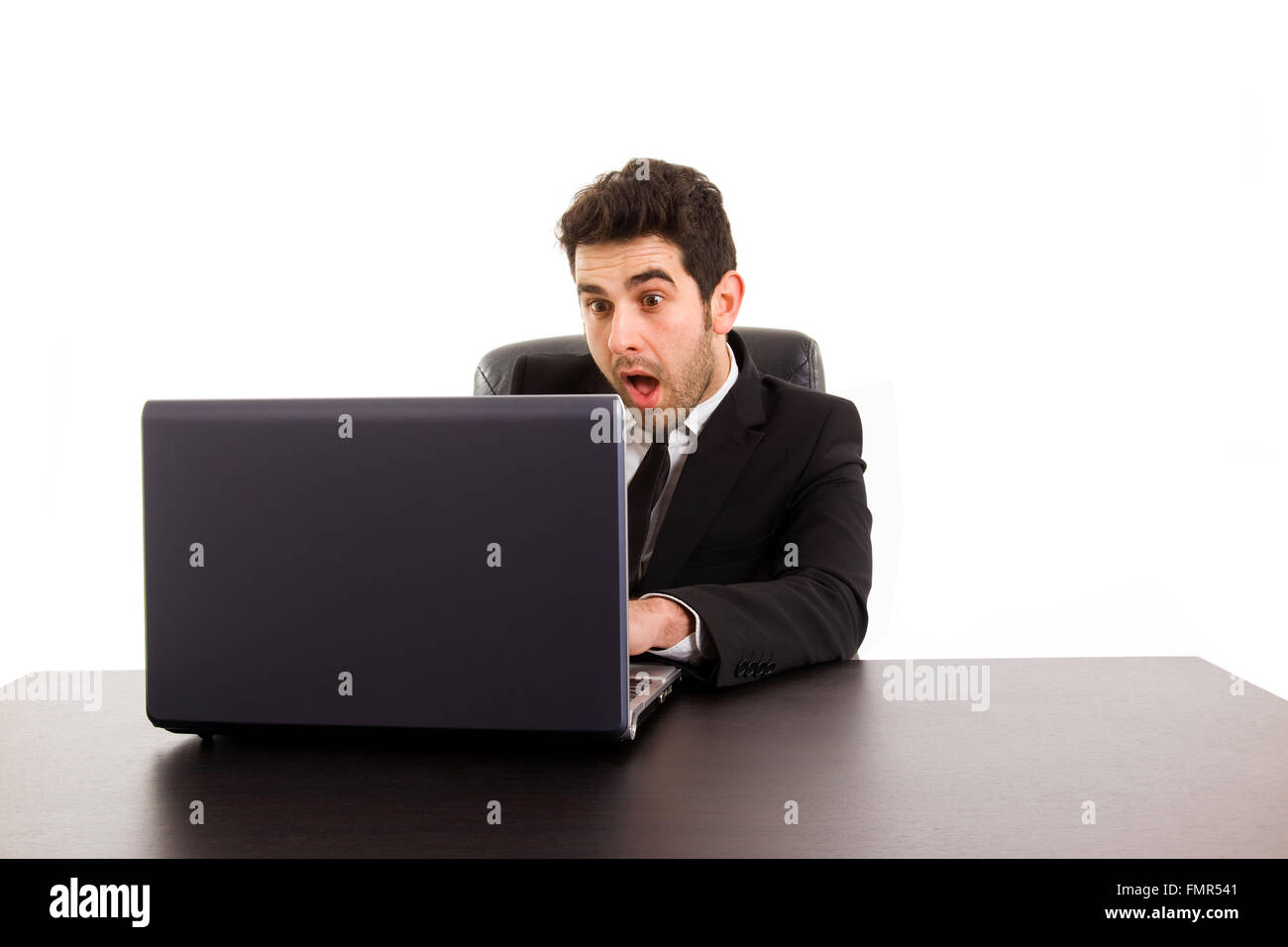 Young business man looking at screen computer with a excited expression ...