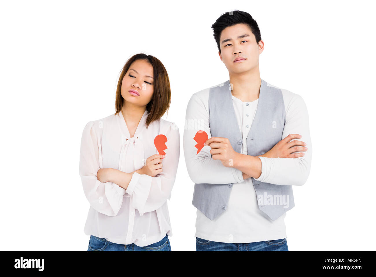 Young couple holding broken heart Stock Photo - Alamy