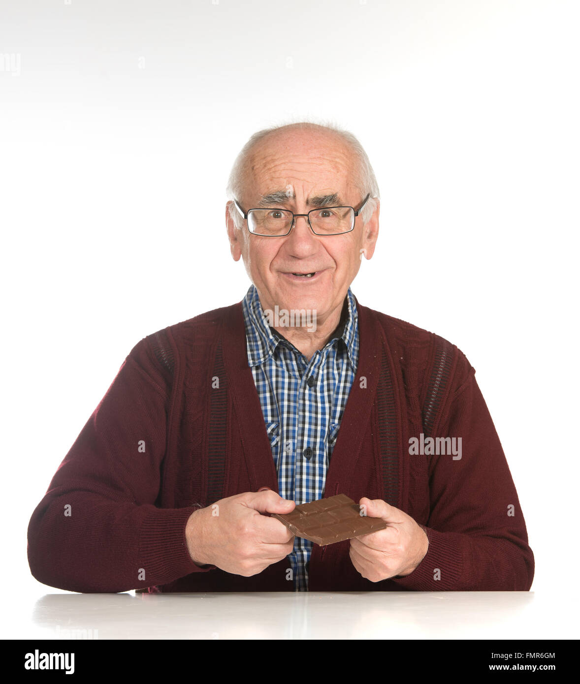 Old senior man eating chocolate hi-res stock photography and images - Alamy