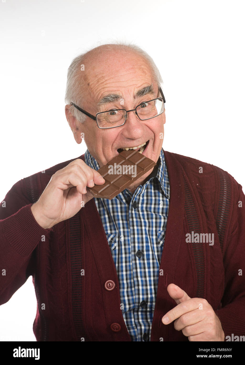 old senior man eating chocolate Stock Photo - Alamy