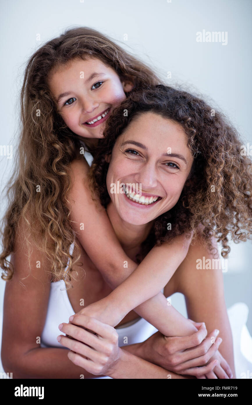 Portrait of mother and daughter embracing Stock Photo - Alamy