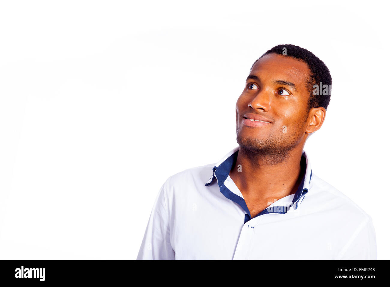 Young man looking up over white background Stock Photo - Alamy