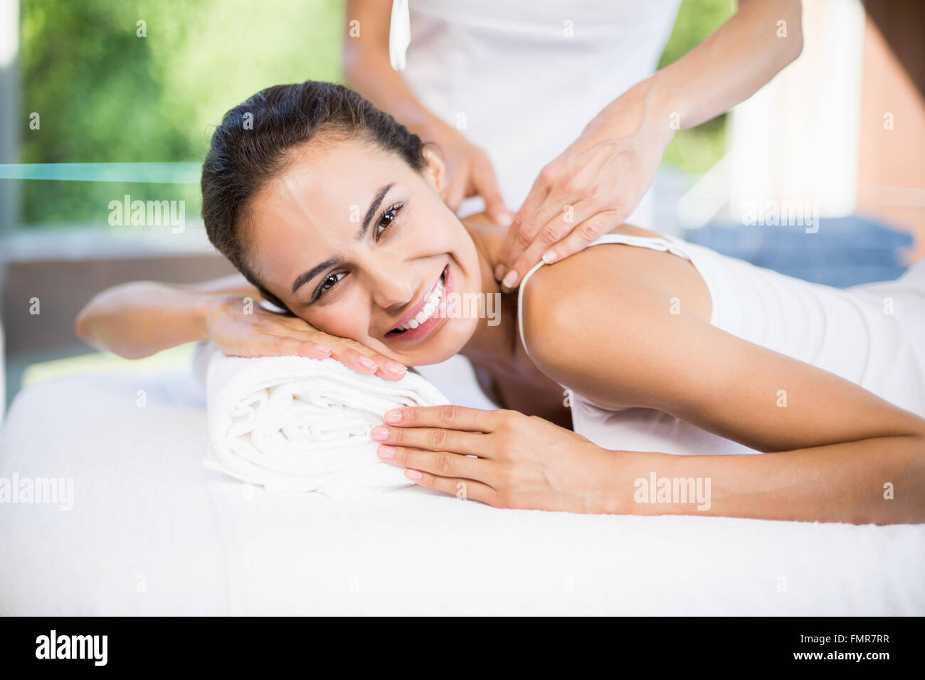 Portrait of happy woman receiving massage Stock Photo - Alamy