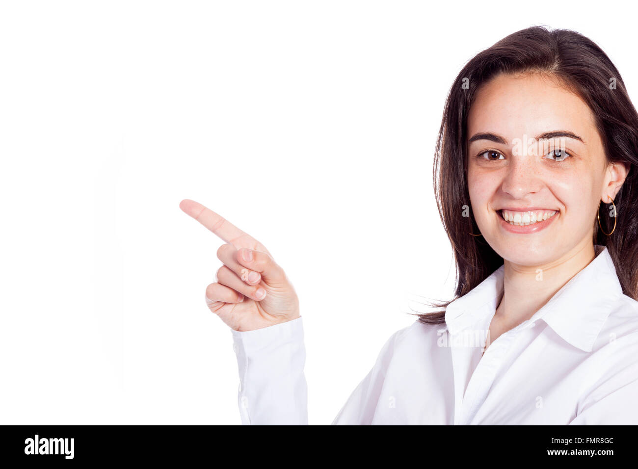Portrait of young beautiful woman pointing at copyspace Stock Photo - Alamy