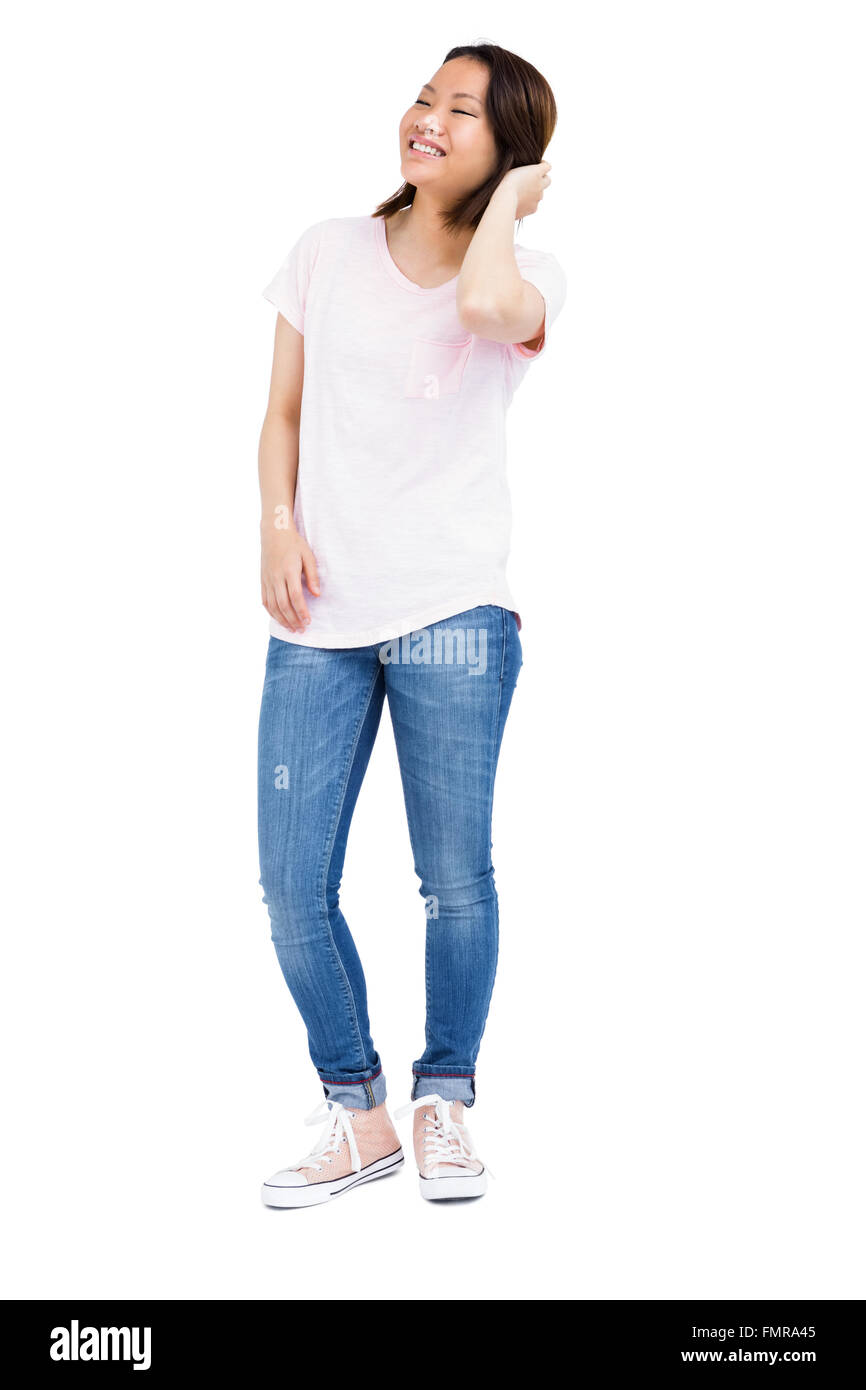 Cheerful young woman looking away and smiling Stock Photo - Alamy