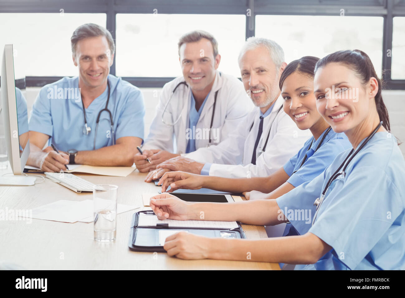 Portrait of happy medical team in conference room Stock Photo - Alamy