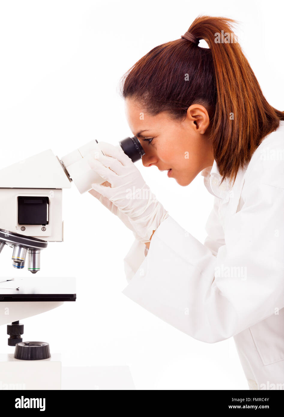 Female researcher looking through microscope, isolated on white Stock ...