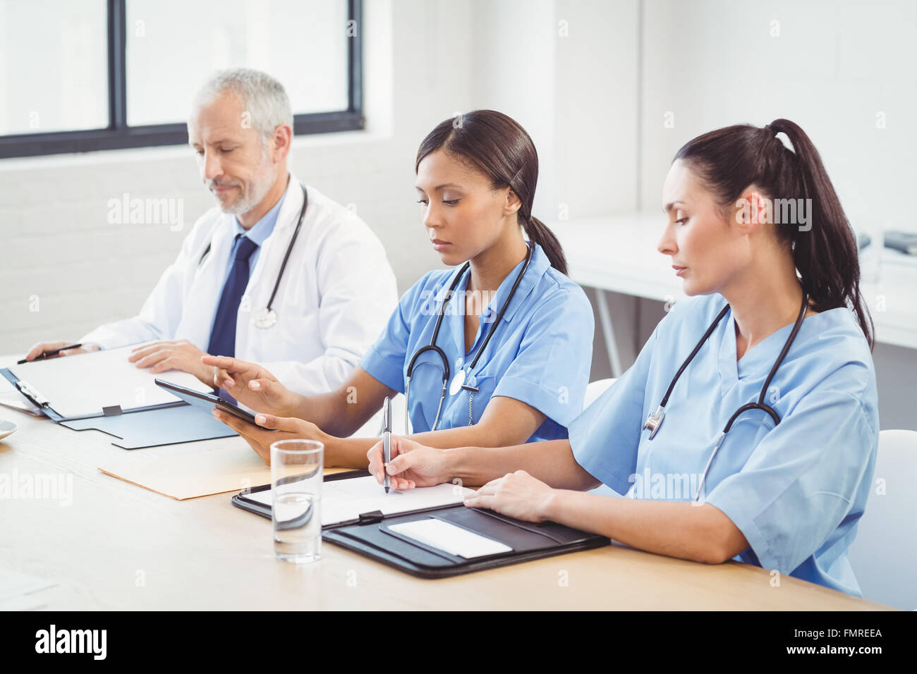 Medical team working in conference room Stock Photo - Alamy