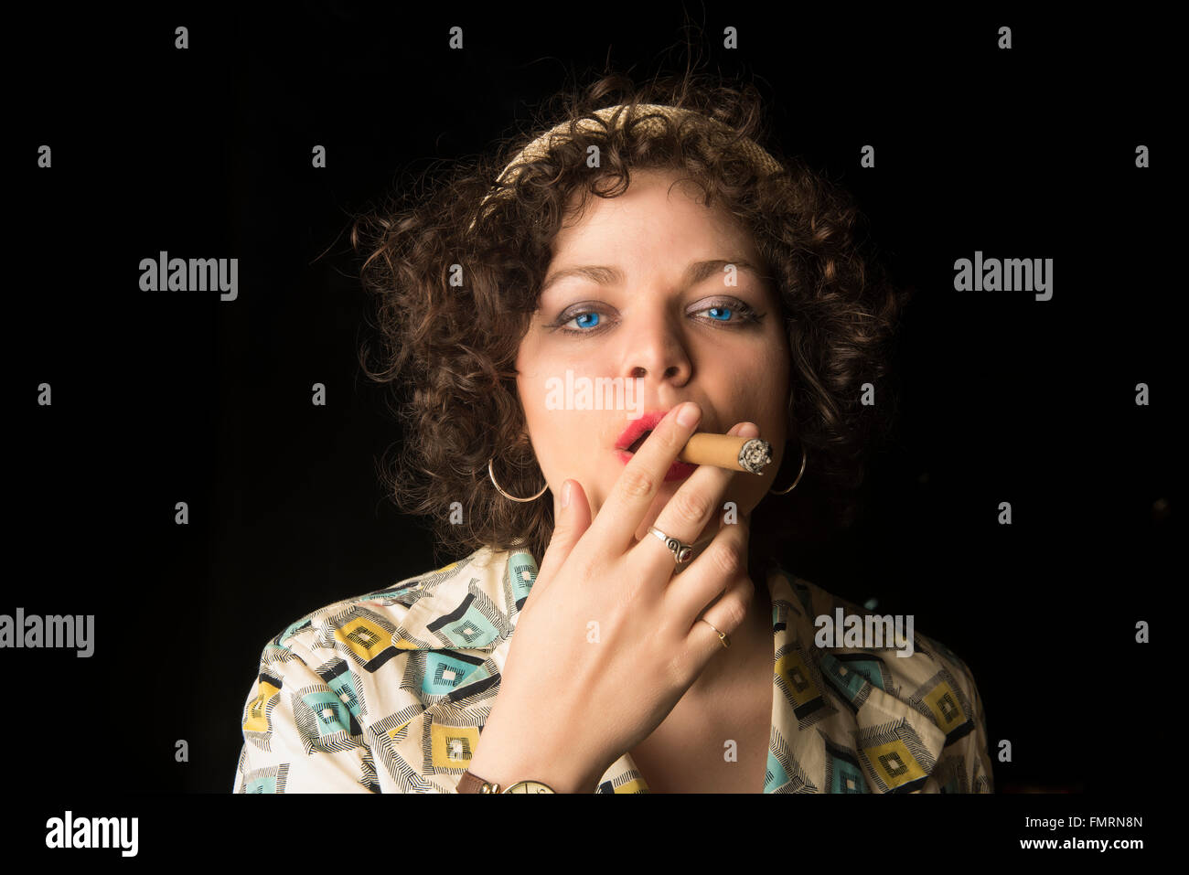 Girl smoking cigar hi-res stock photography and images - Alamy