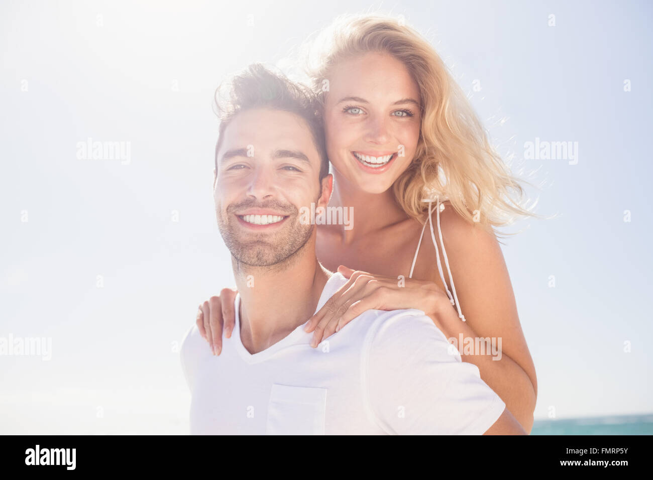 Boyfriend giving piggy back to girlfriend Stock Photo - Alamy