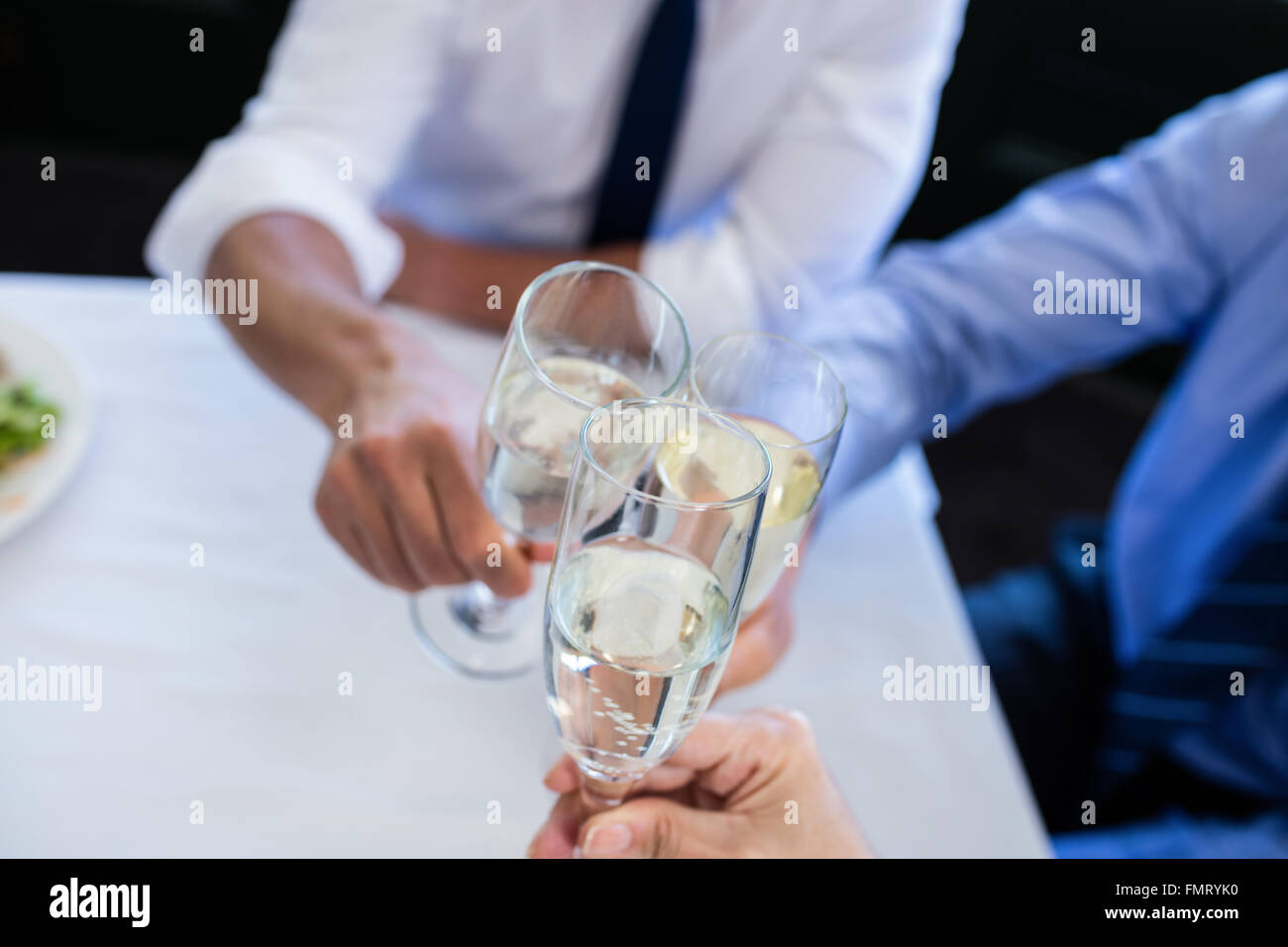 Hands toasting champagne flutes Stock Photo - Alamy