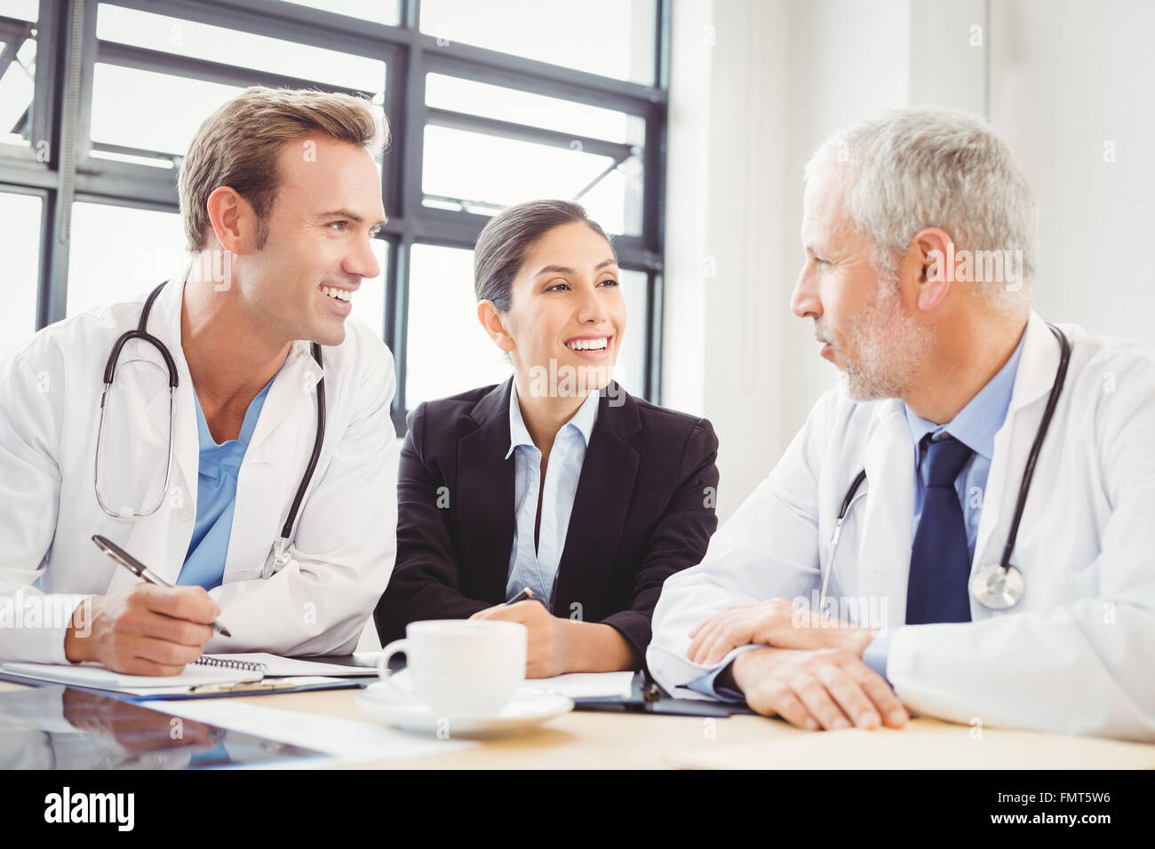 Medical team interacting in conference room Stock Photo - Alamy