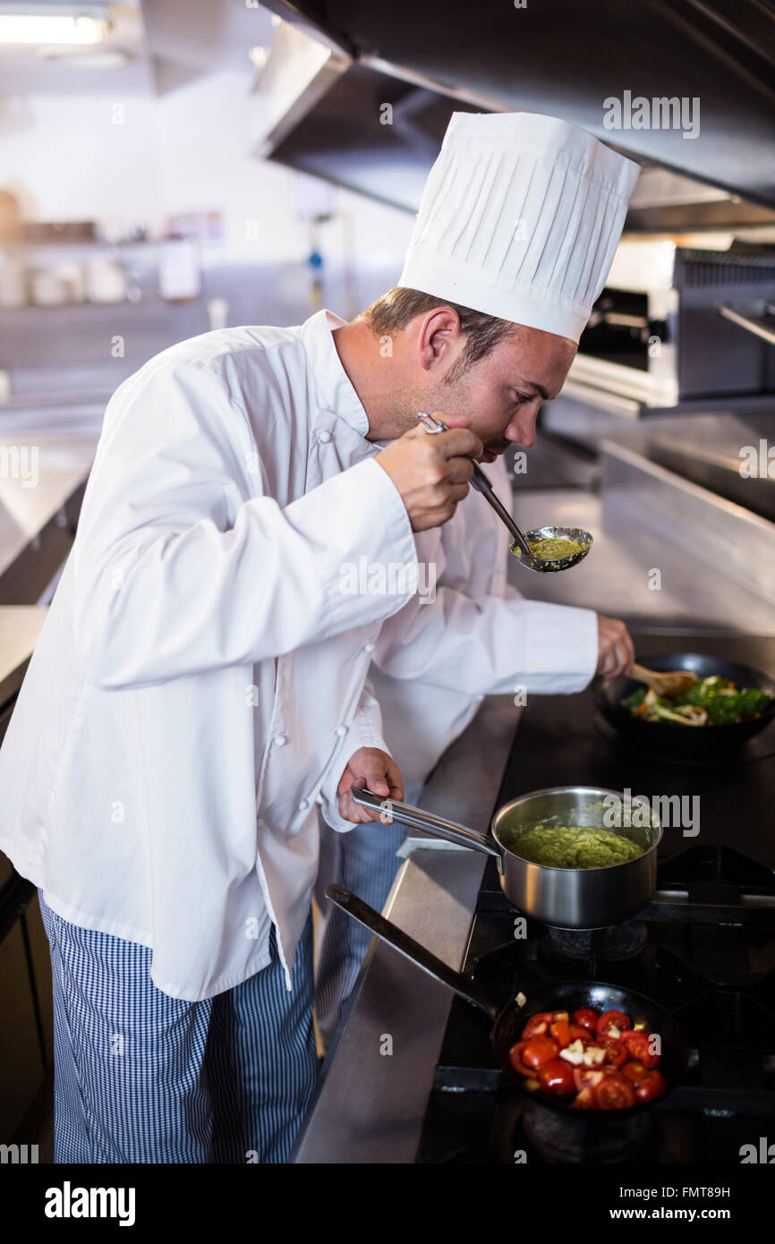 Chef smelling food in kitchen hi-res stock photography and images - Alamy