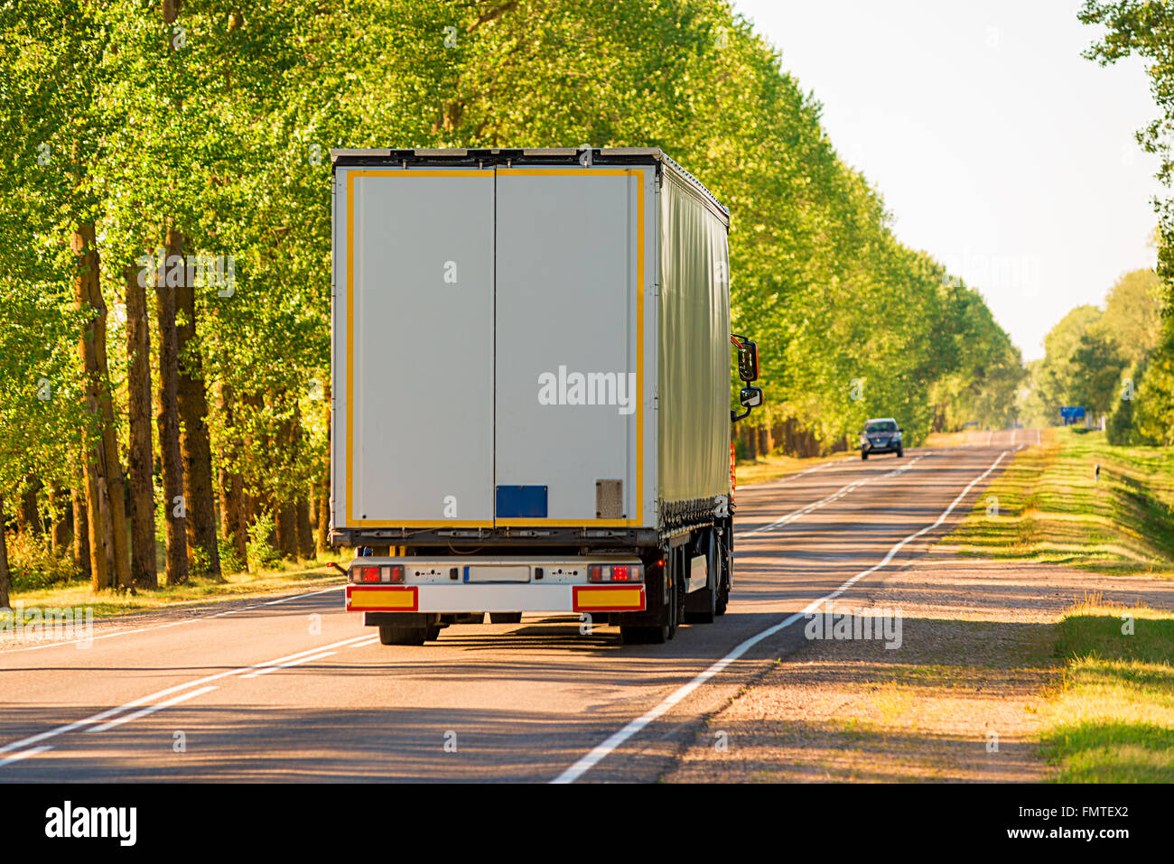 truck on a rural road in summer day Stock Photo - Alamy