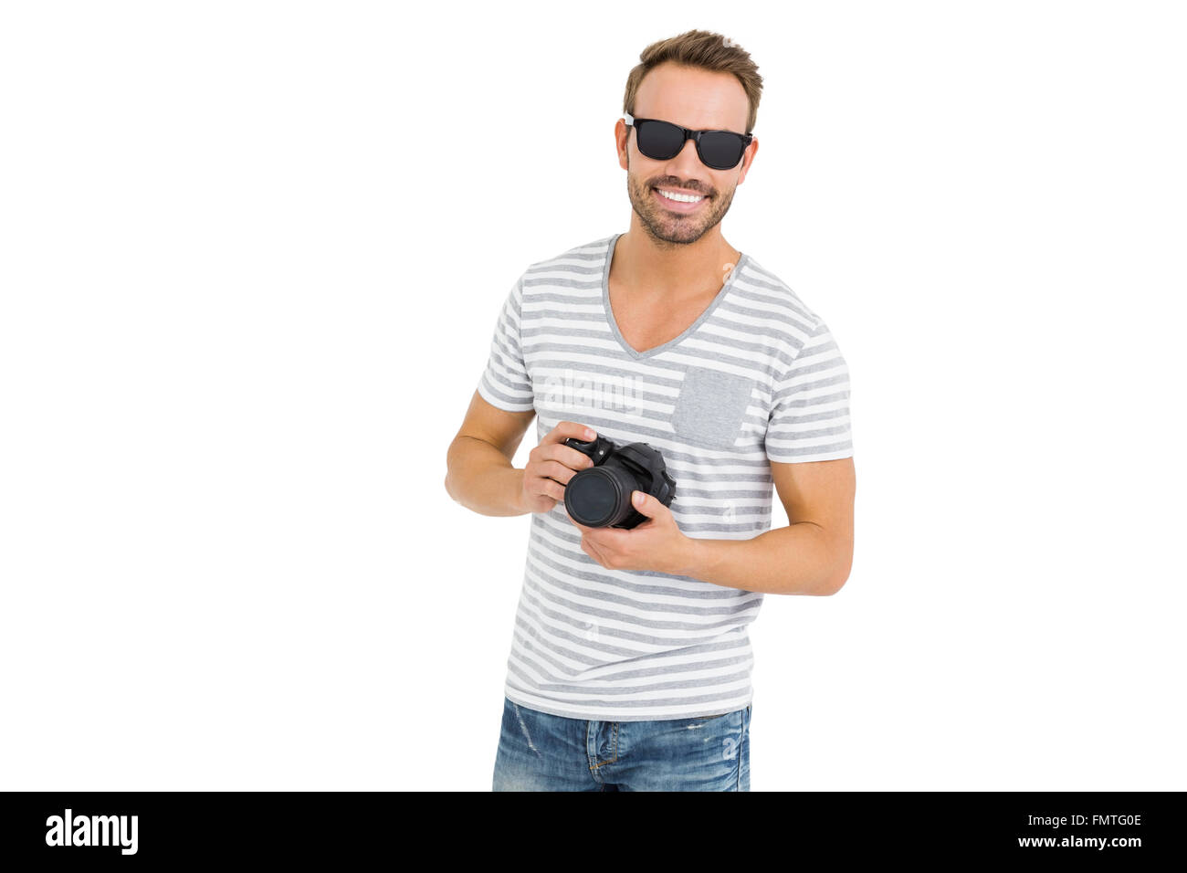 Young man holding digital camera Stock Photo - Alamy