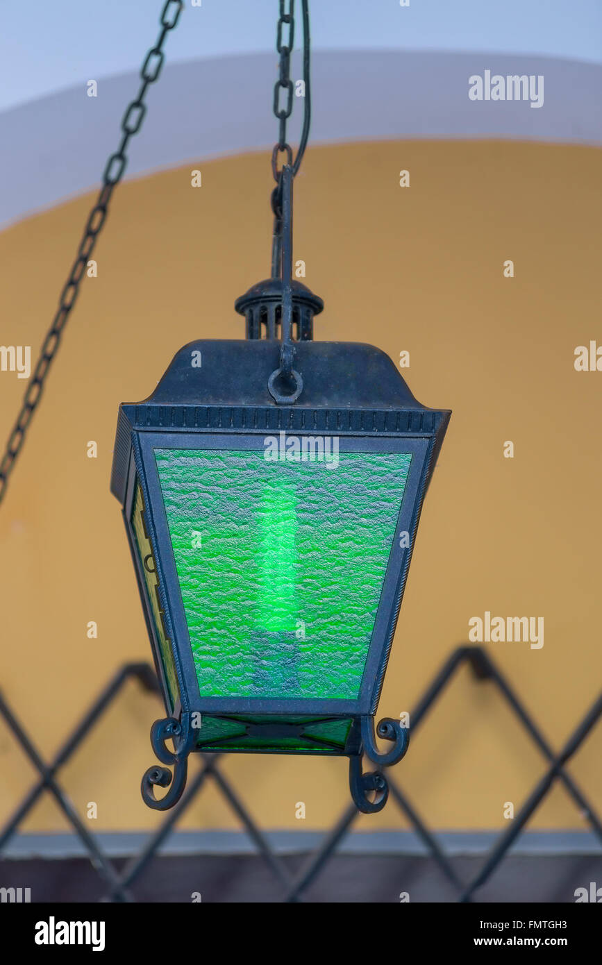 Vintage lantern on the street hanging on a chain Stock Photo - Alamy