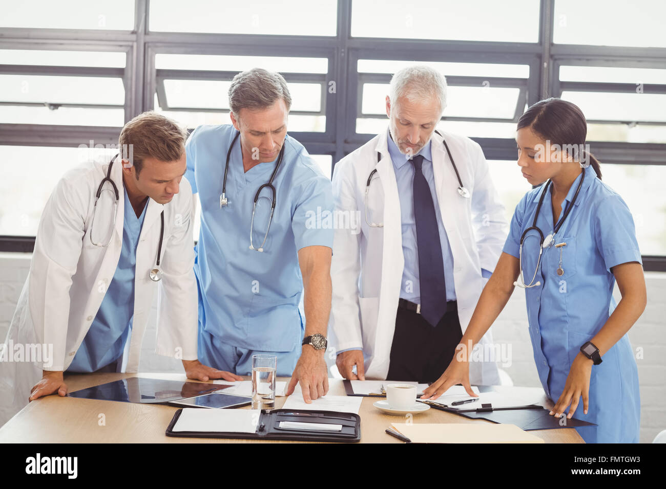 Medical team interacting in conference room Stock Photo - Alamy