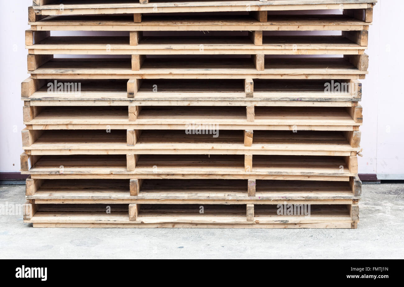 Wooden pallet stack near the warehouse of factory Stock Photo - Alamy