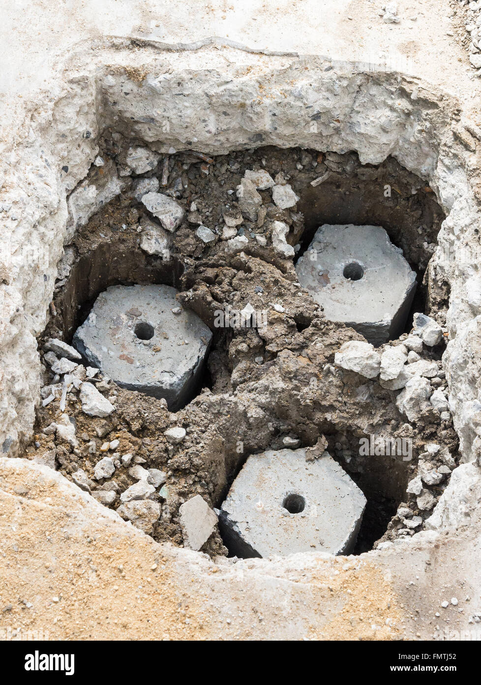 Concrete hexagonal columns in the hole for home Improvement Stock Photo ...
