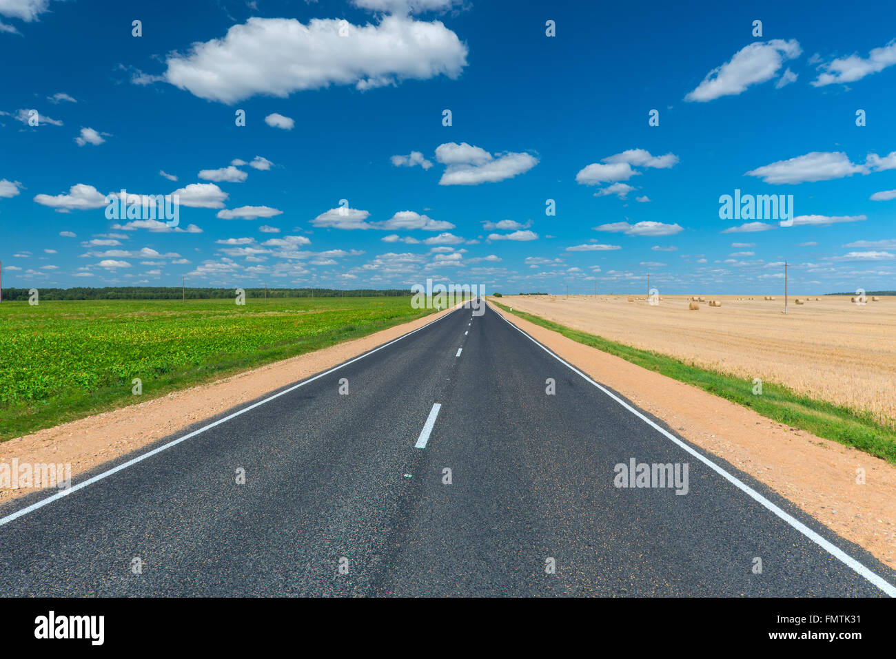 Fields on either side of road hi-res stock photography and images - Alamy