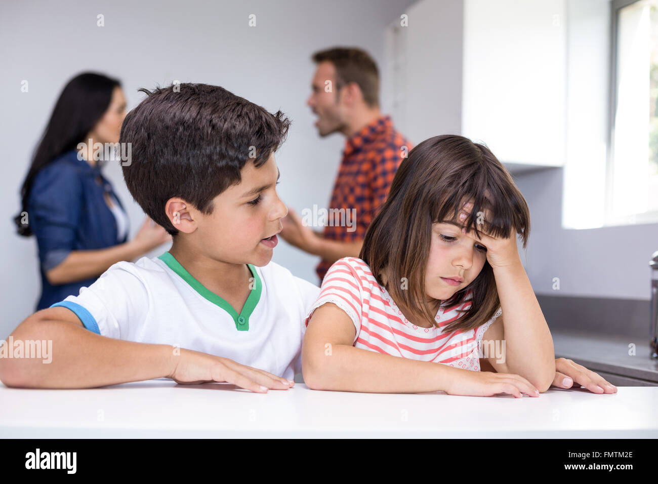 Parents arguing in front of children Stock Photo - Alamy