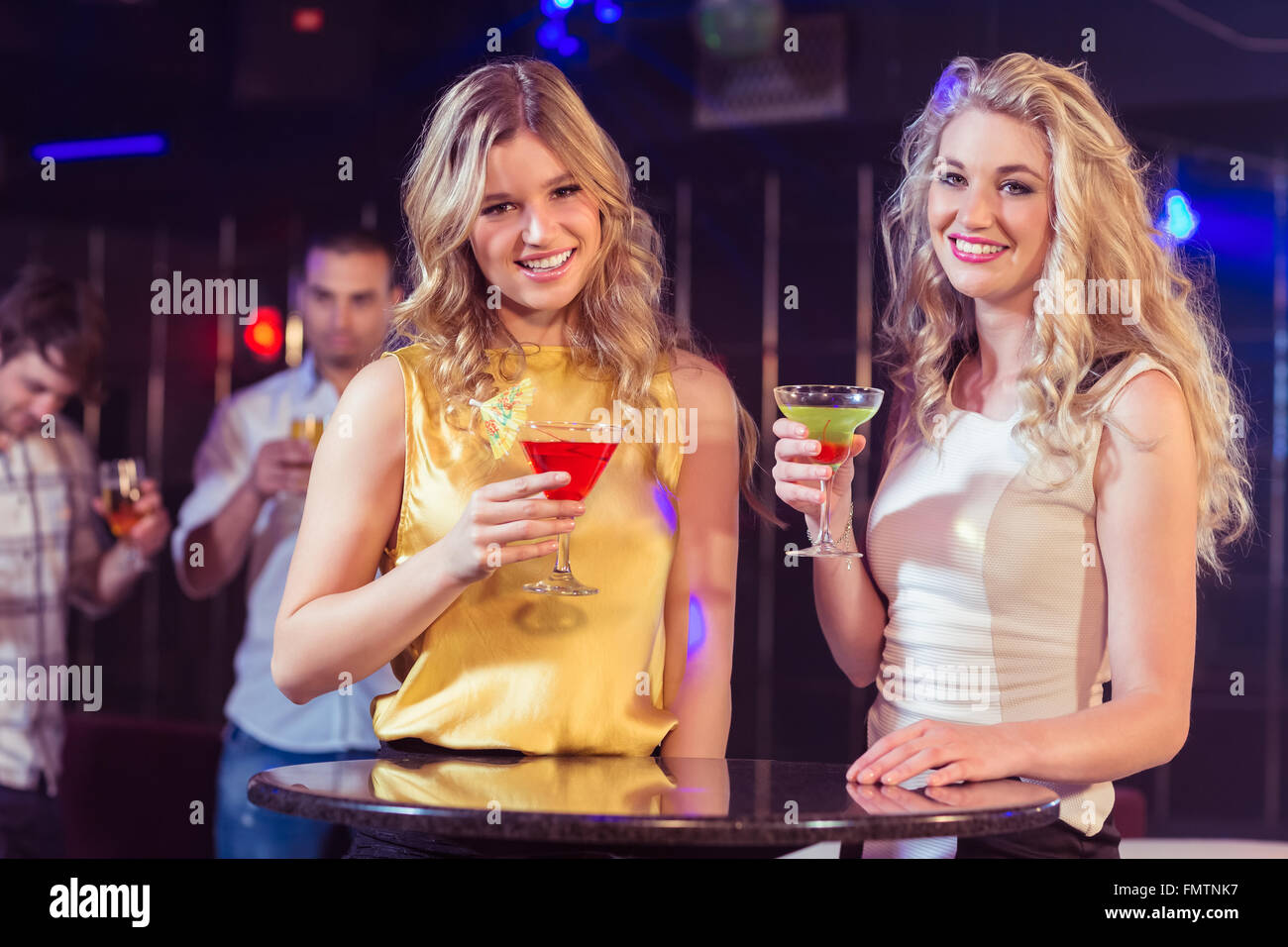 Pretty girls with cocktails Stock Photo - Alamy