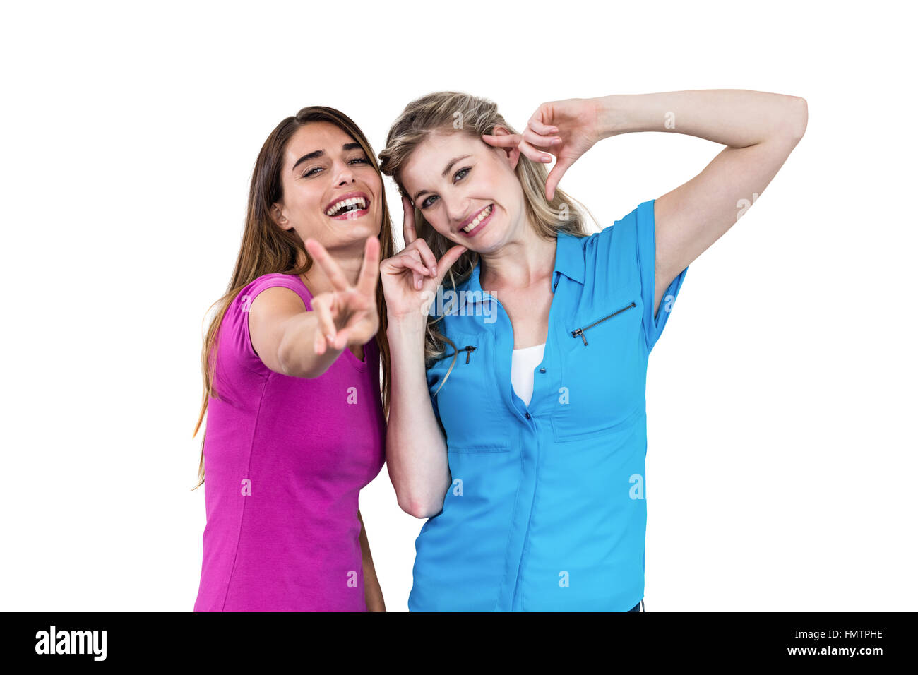 Female friends smiling gesturing hi-res stock photography and images ...