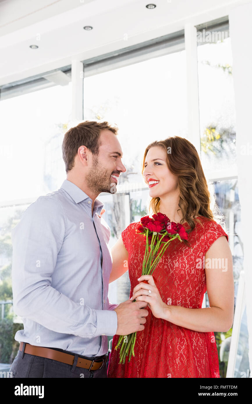 Man offering flower bouquet to woman Stock Photo - Alamy