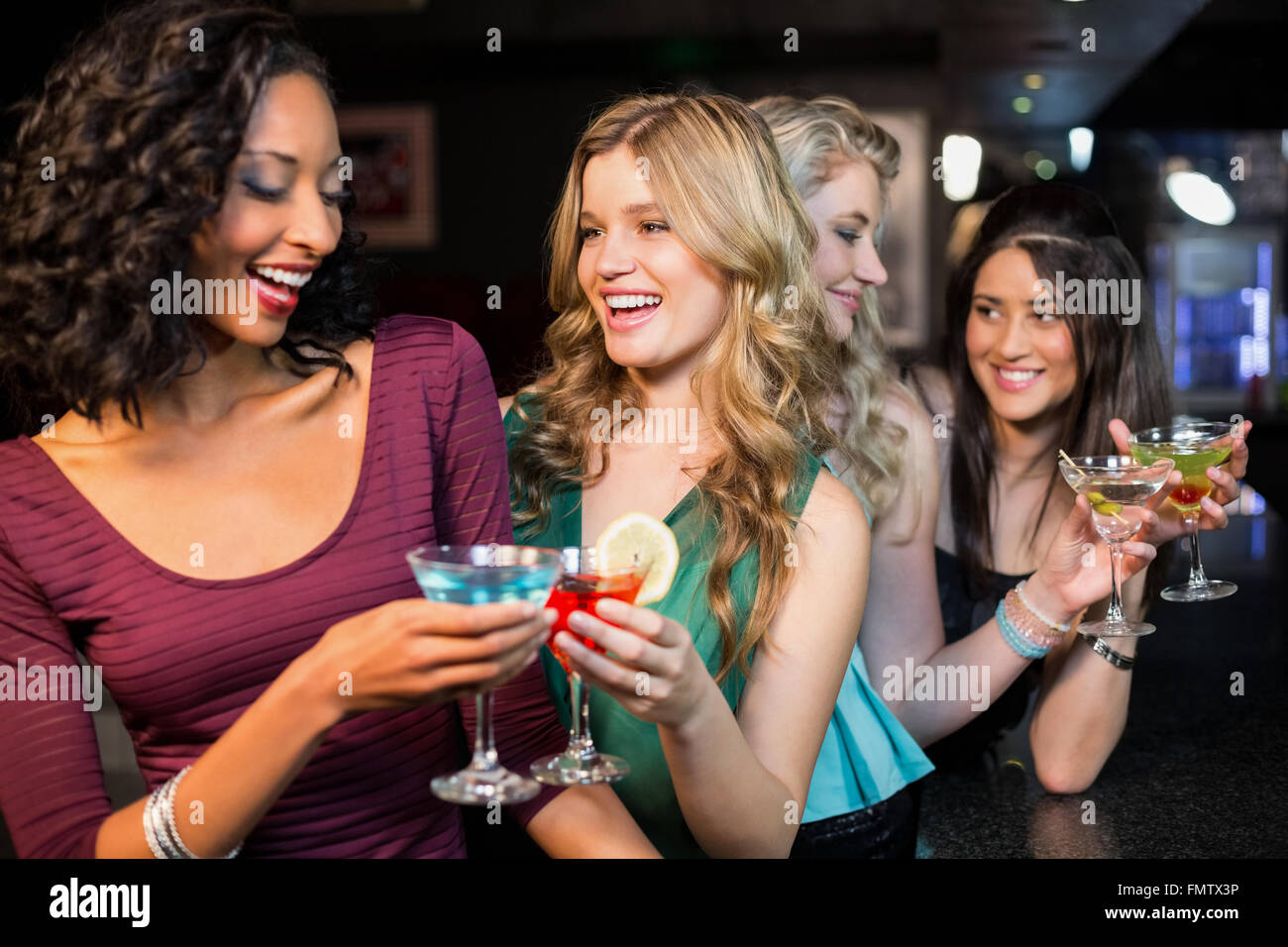 Portrait of friends having a drink Stock Photo - Alamy