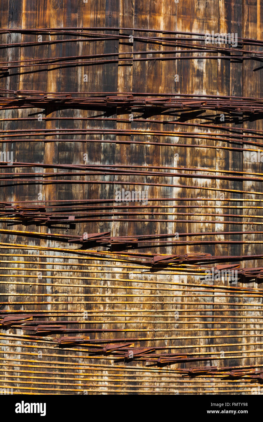 Abstract image of tension hoops around an old wooden water storage vat ...