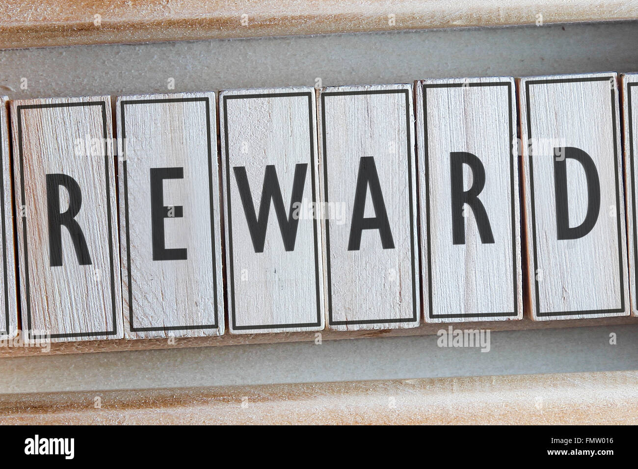 Reward word written on wood Stock Photo - Alamy