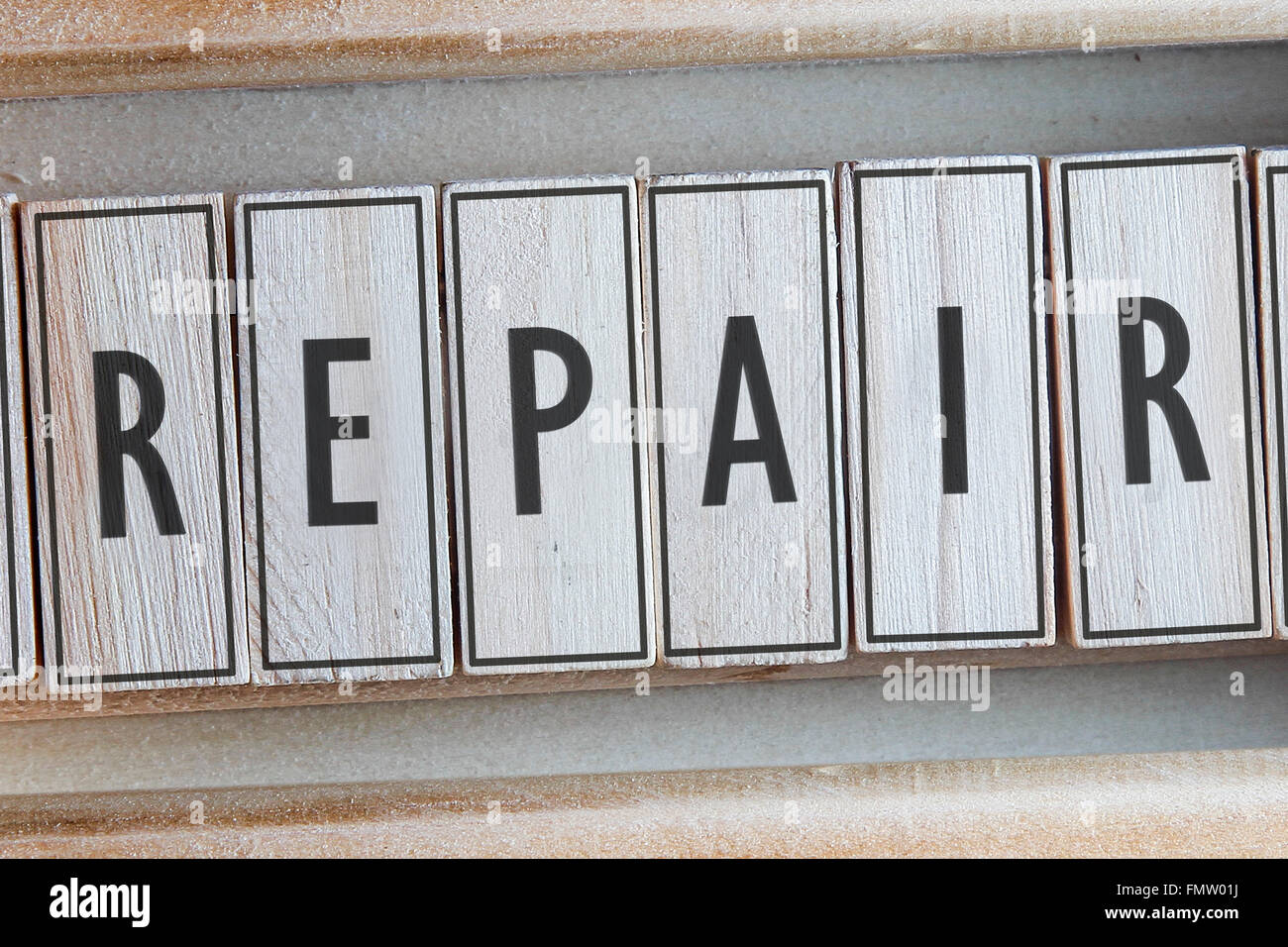 Repair word written on wood Stock Photo - Alamy