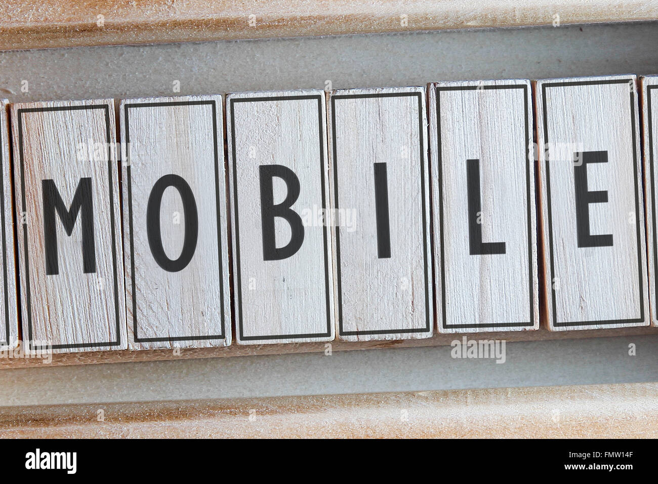 Mobile word written on wood Stock Photo - Alamy