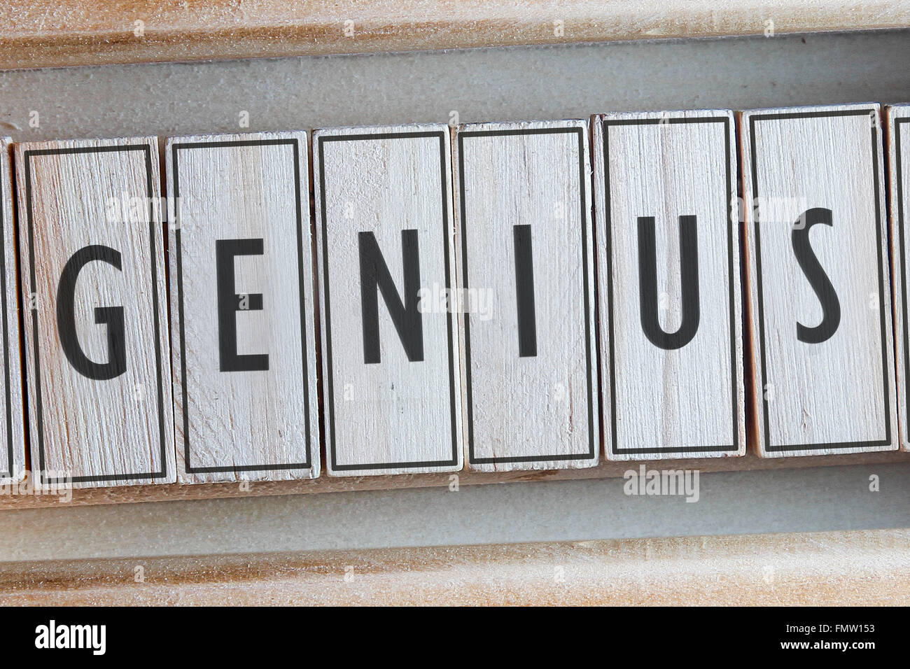 Genius word written on wood Stock Photo - Alamy