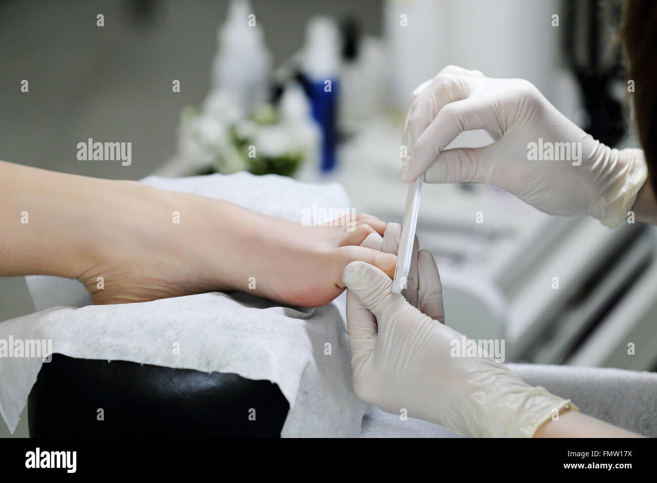 The big toe is doing pedicure nail file Stock Photo - Alamy