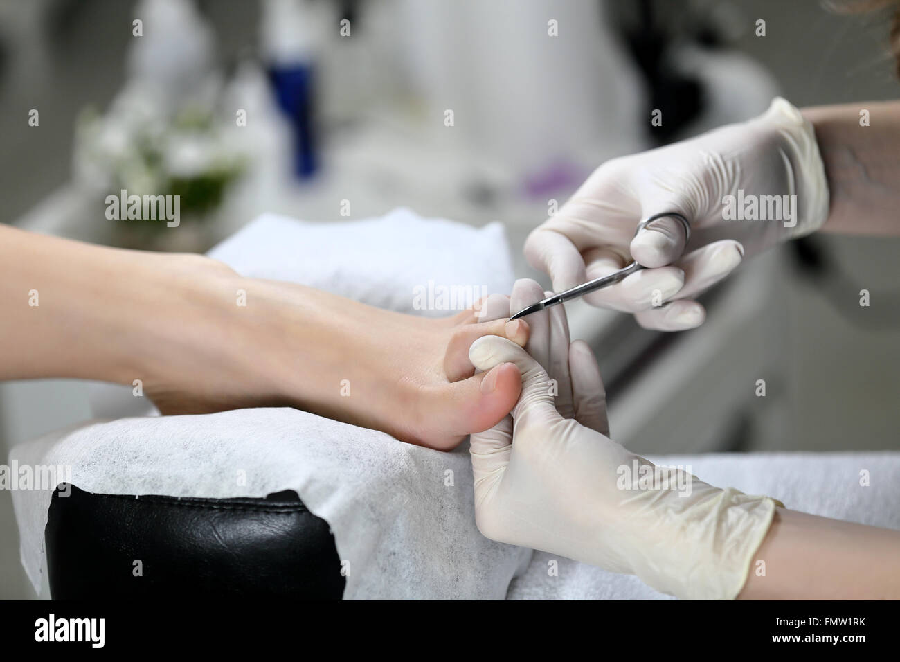 Close up Cutting cuticle on foot, nail scissors Stock Photo - Alamy