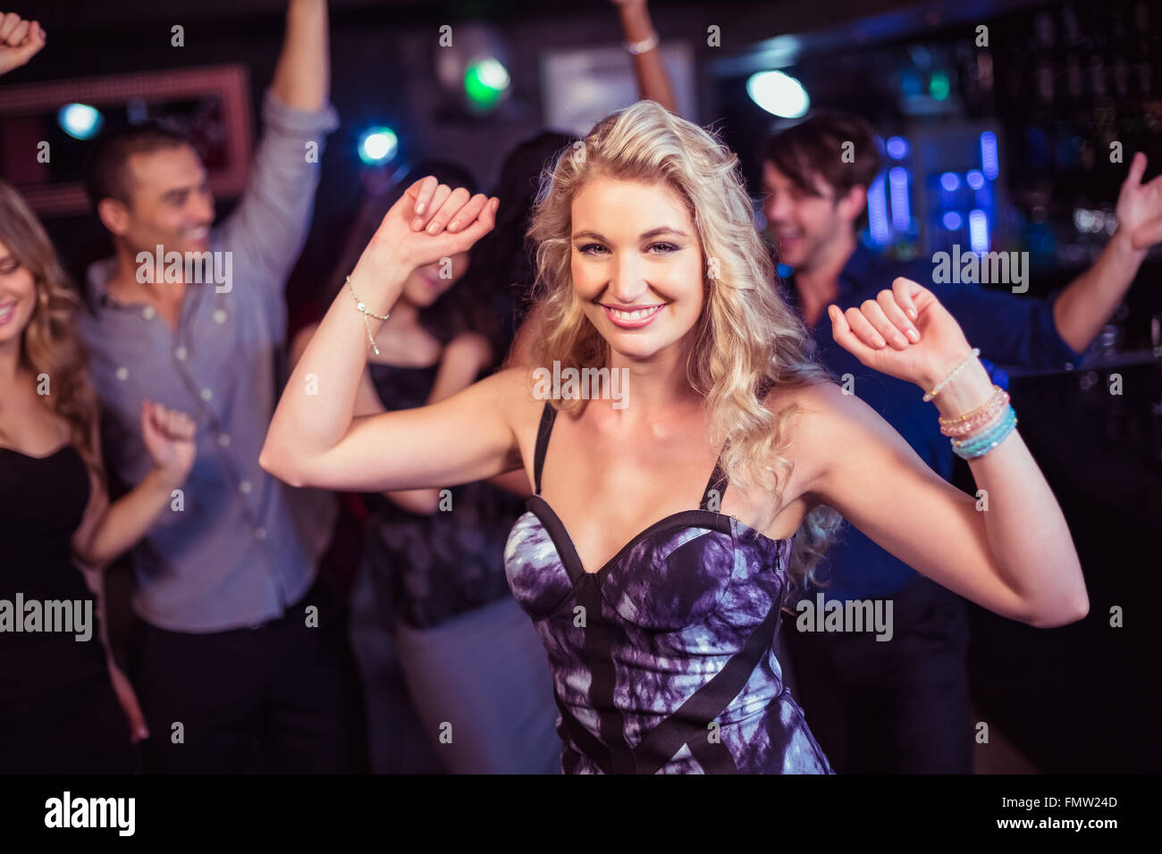 Cute friends having fun and dancing Stock Photo - Alamy