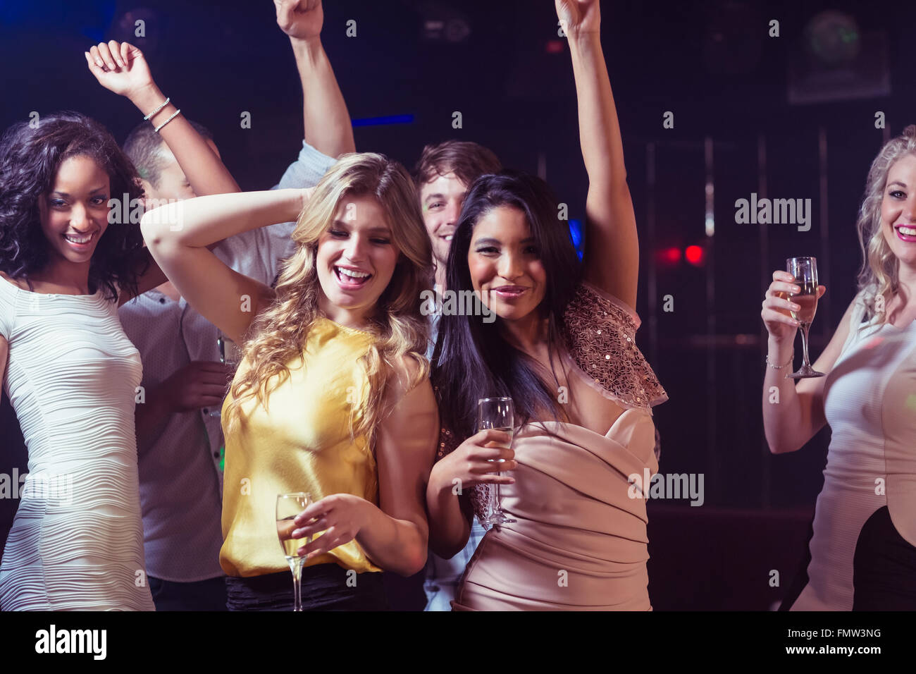 Happy friends dancing Stock Photo - Alamy