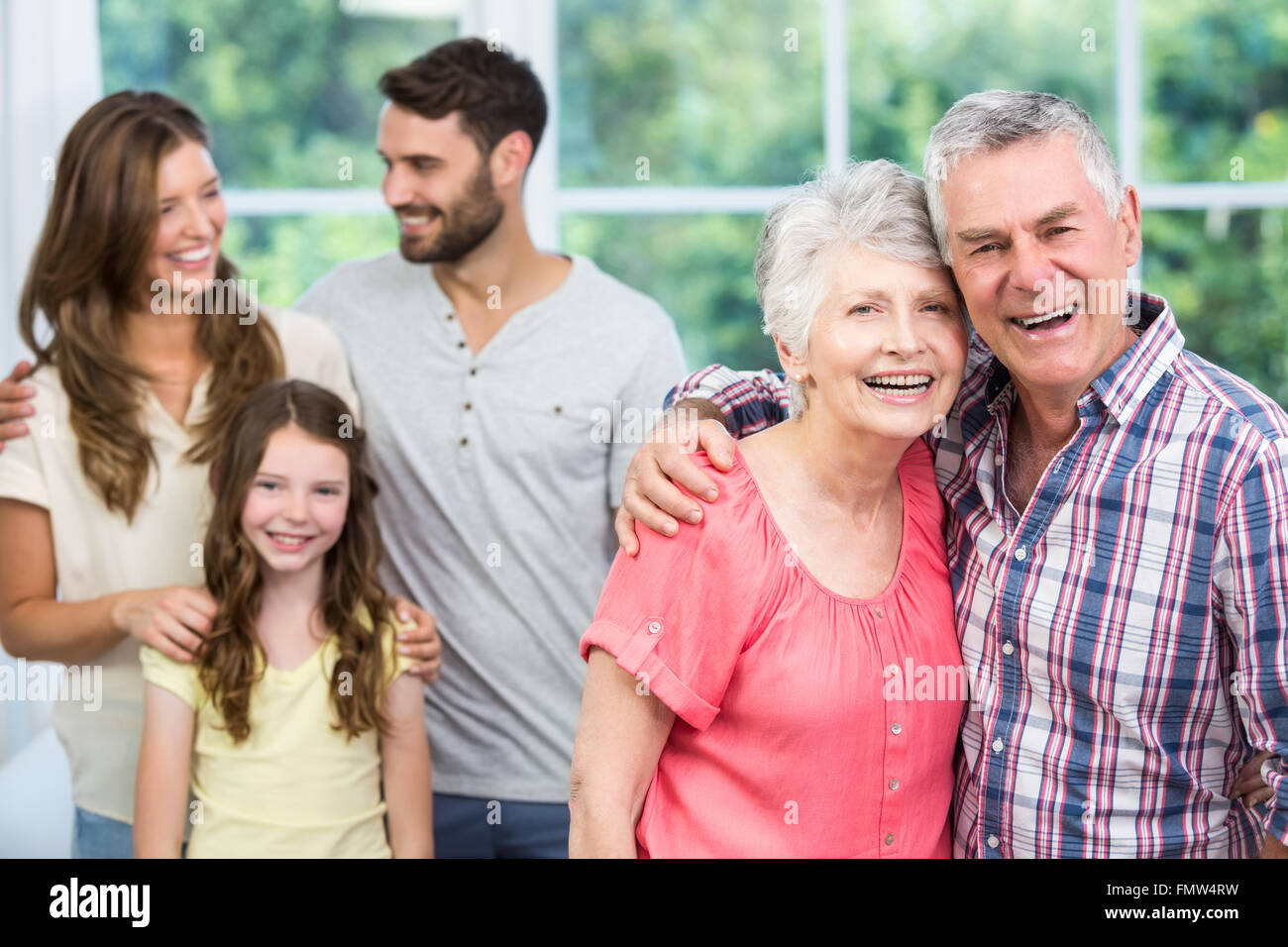 Portrait of grandparents with family Stock Photo - Alamy
