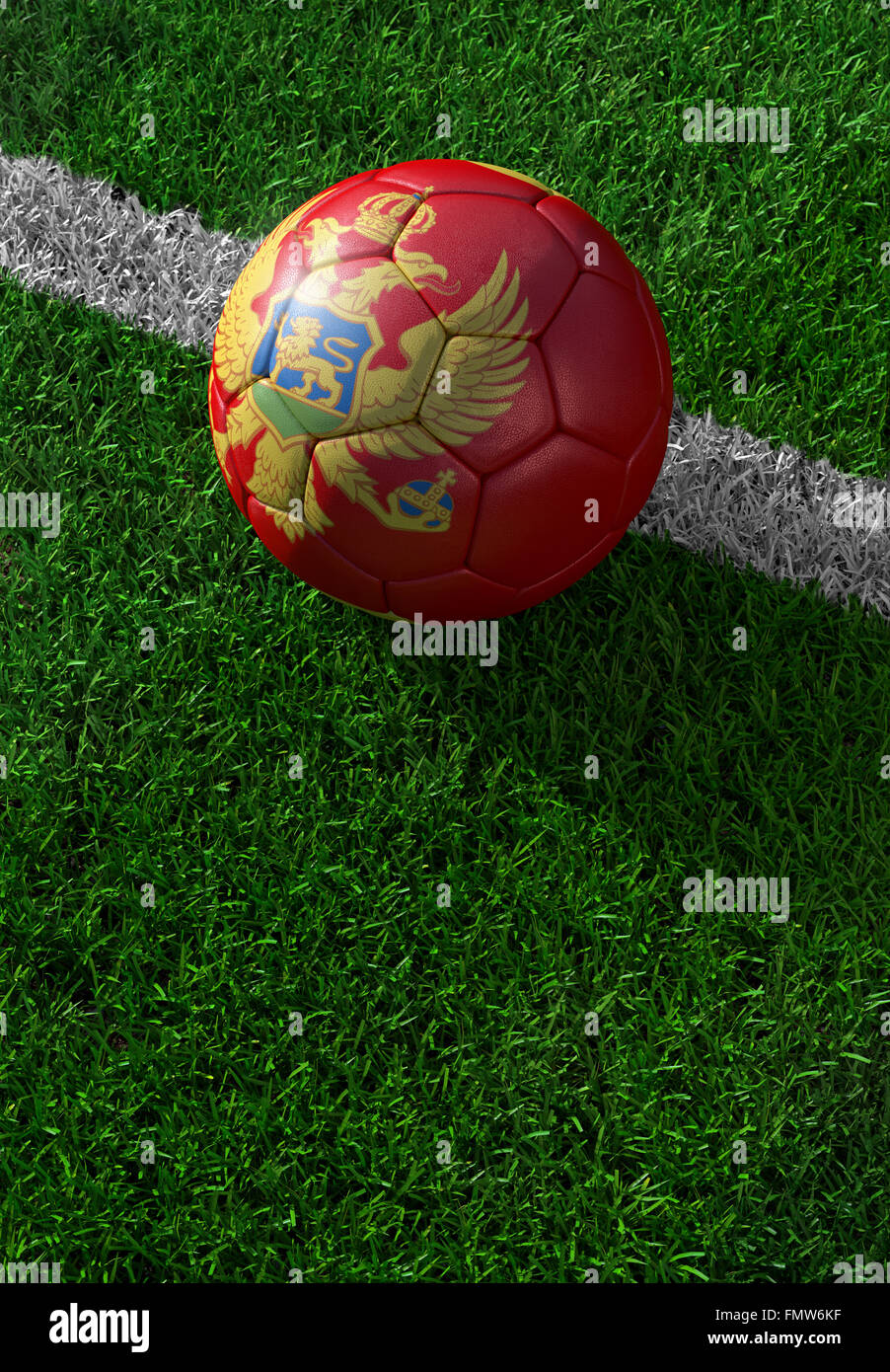 Soccer ball and national flag of Montenegro lies on the green grass ...