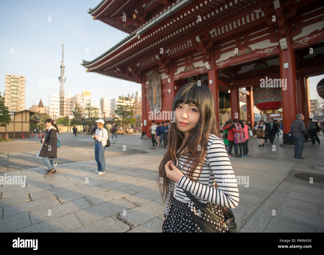 A young Japanese lady at Tokyo's premiere tourist attraction Sensoji ...