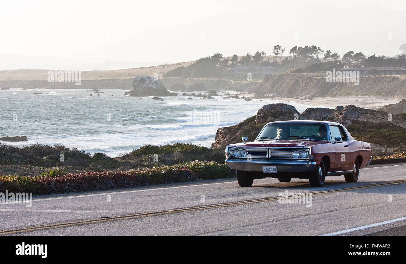Old classic car driving along national highway 1 hi-res stock ...