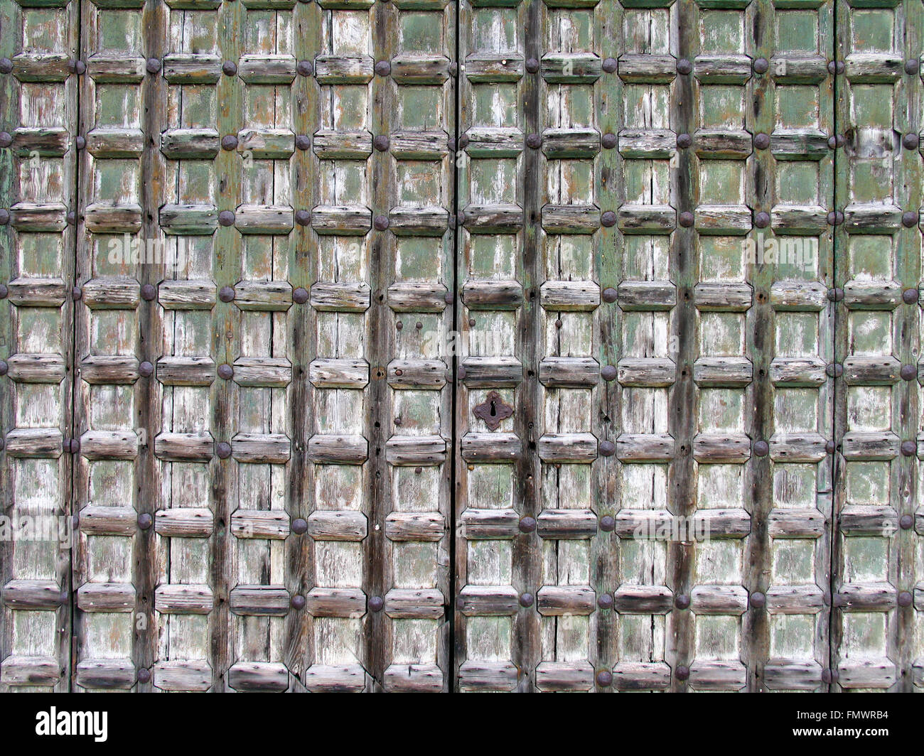 A weathered double door with a square pattern Stock Photo - Alamy