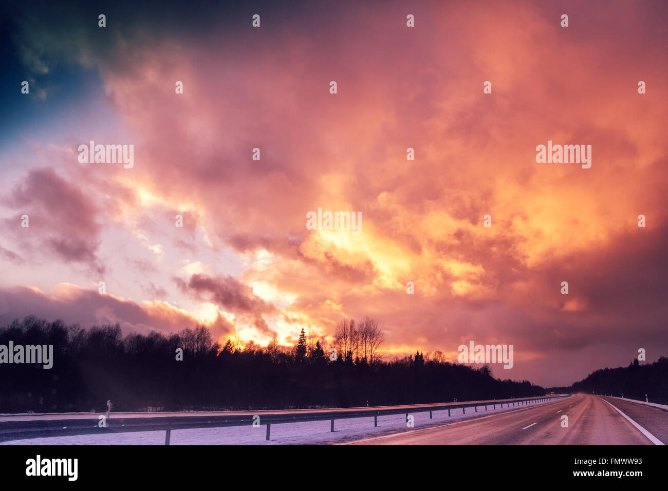 Autobahn at sunset with dramatic purple sky Stock Photo - Alamy