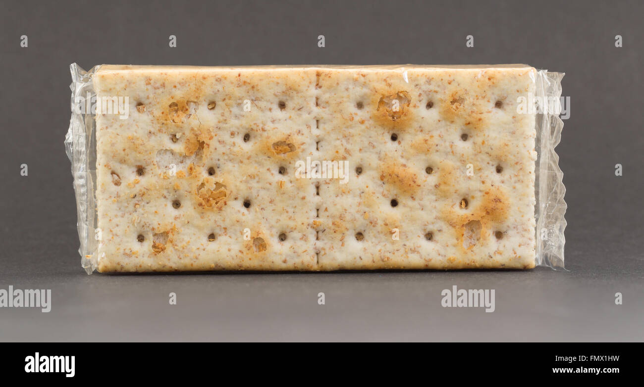 Crackers in plastic, isolated on a grey background Stock Photo - Alamy