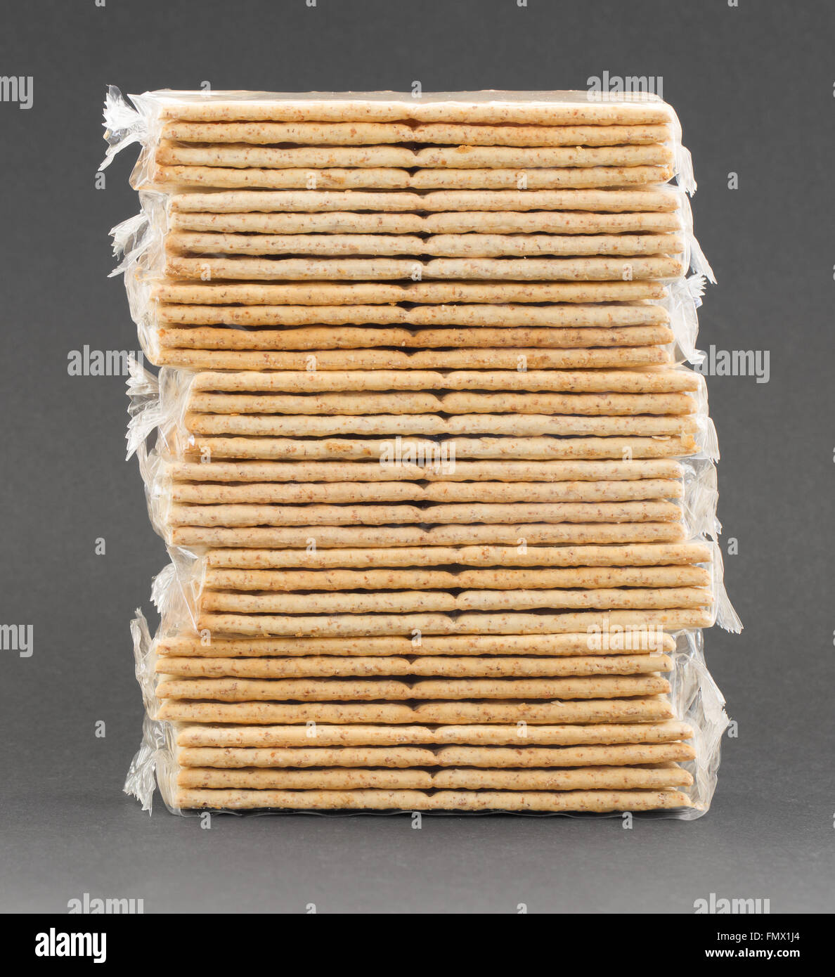 Crackers in plastic, isolated on a grey background Stock Photo - Alamy
